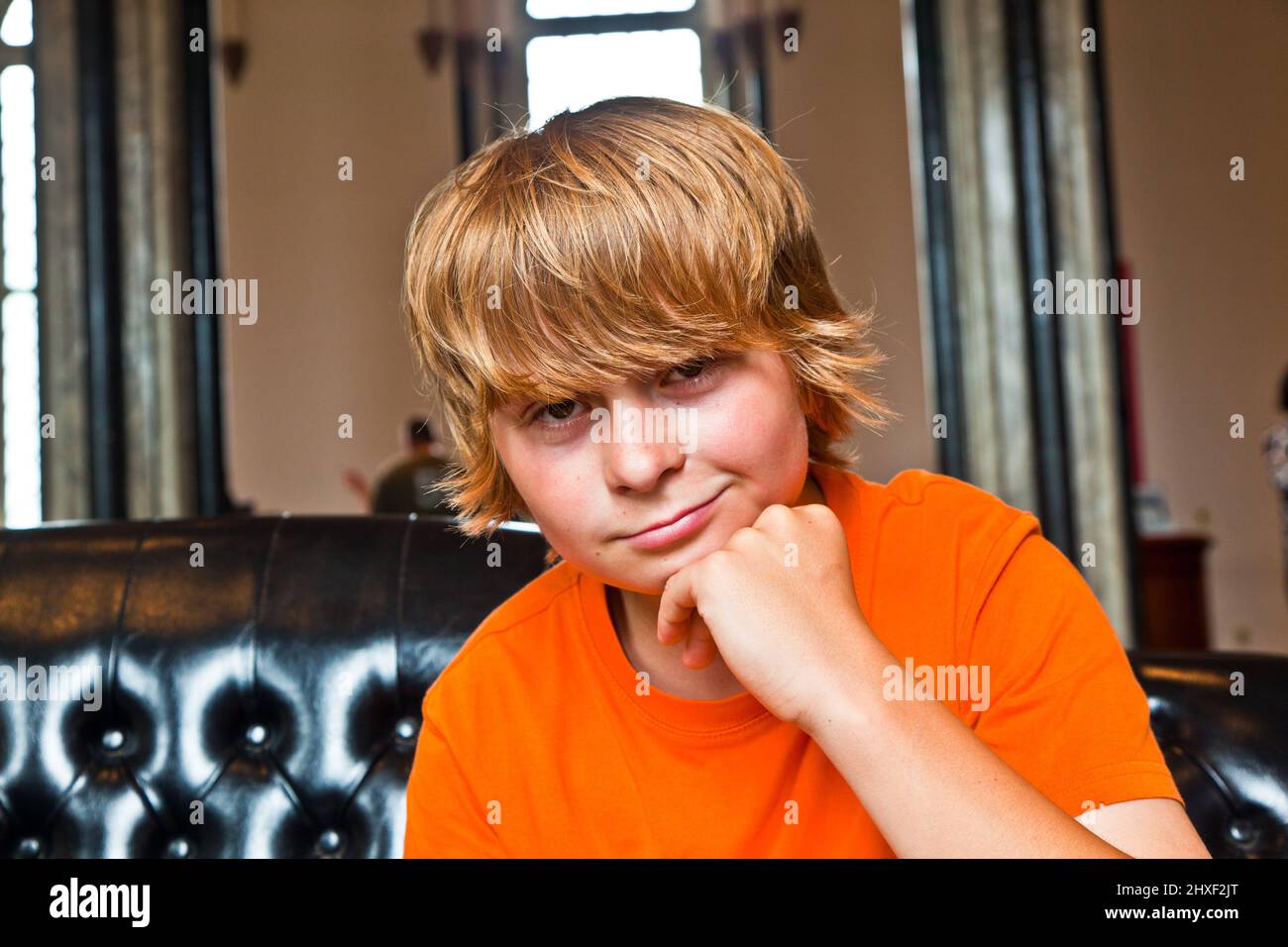 boy takes a rest at a sofa in the Entrance of the Smithonean Museum in ...