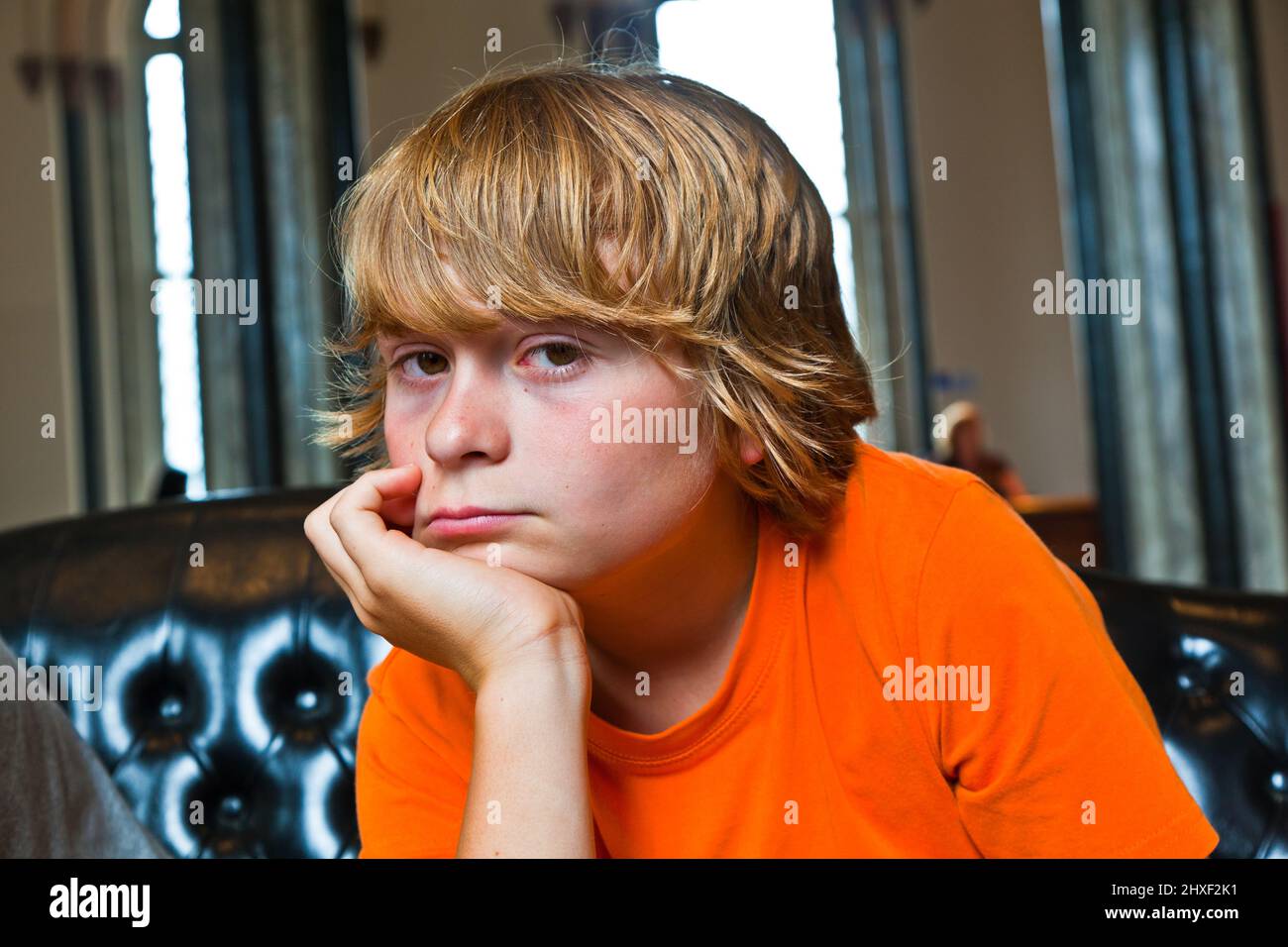 boy takes a rest at a sofa in the Entrance of the Smithonean Museum in ...