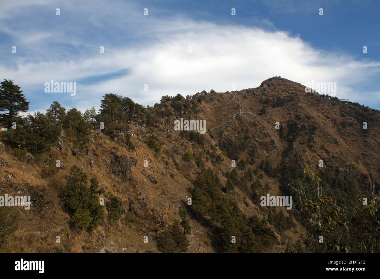 The photograph was taken in the afternoon under blue sky, with rough ...