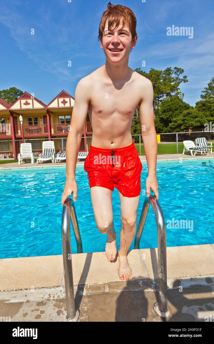cute boy has fun in the outdoor pool Stock Photo - Alamy