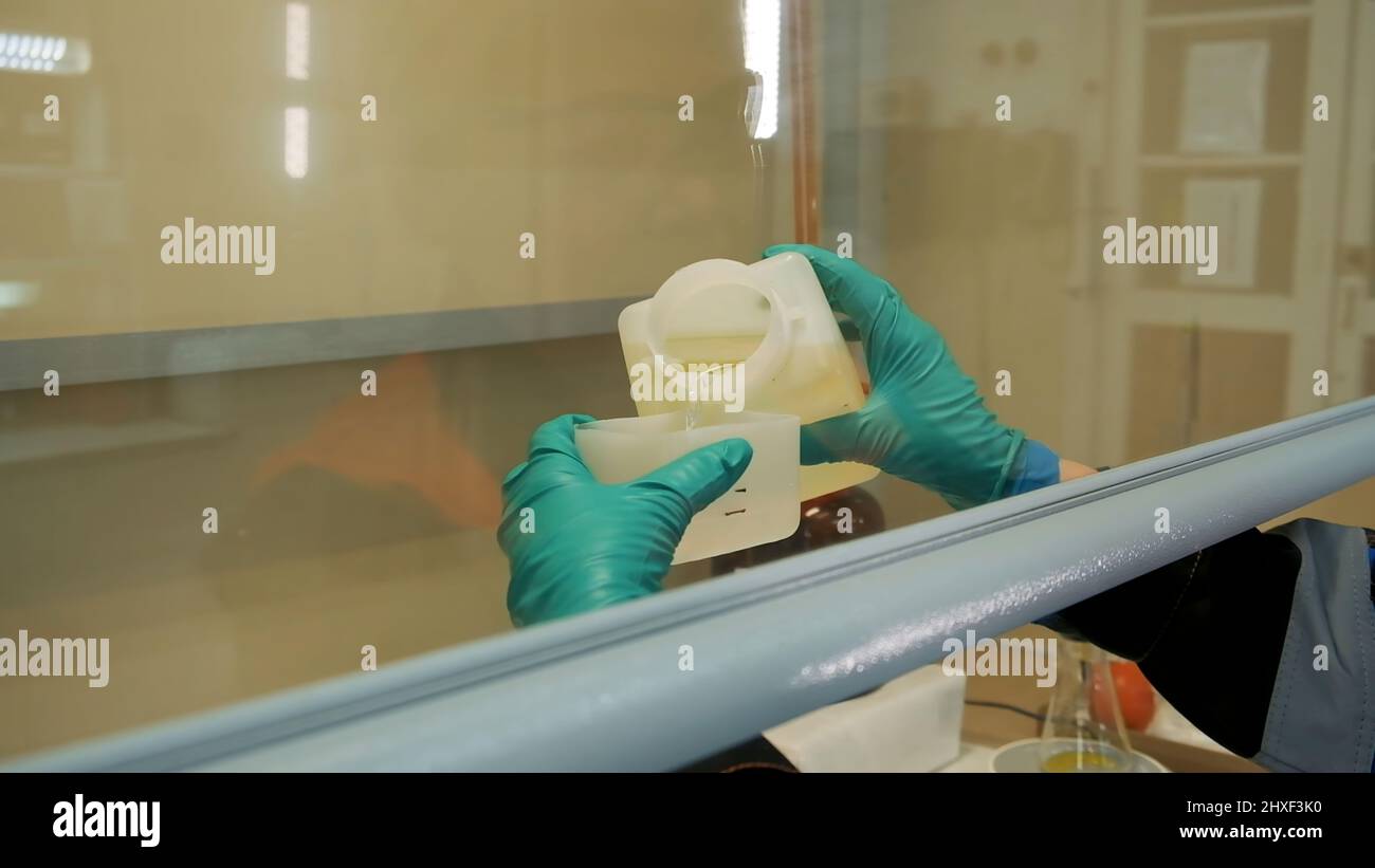 Work in the laboratory. Clip. The job of a chemist who pours liquid and ...