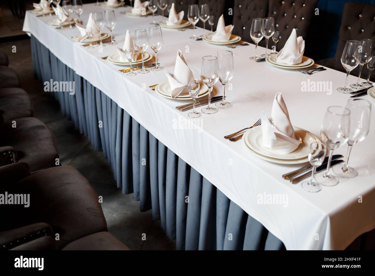 Serving a festive table in a restaurant. Preparation of a banquet for a ...