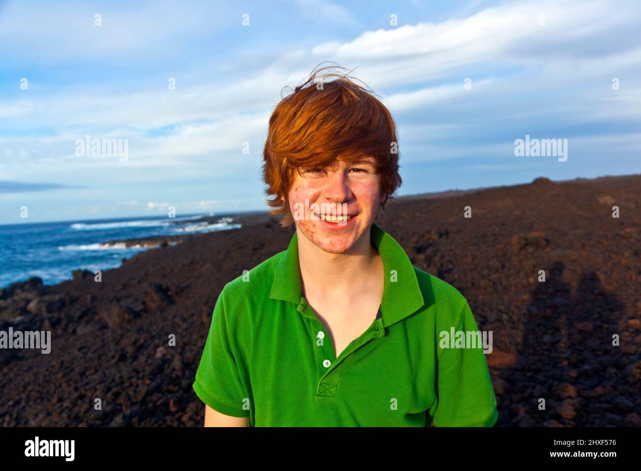 boy walking on volcanic stones in natural parc in lanzarote Stock Photo ...