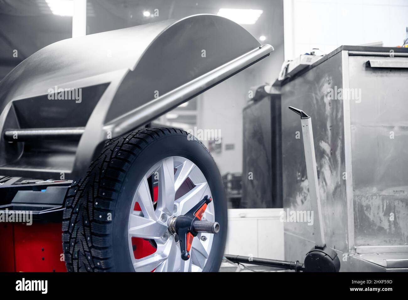 Automatic wheel balancing on stand in car service Stock Photo - Alamy