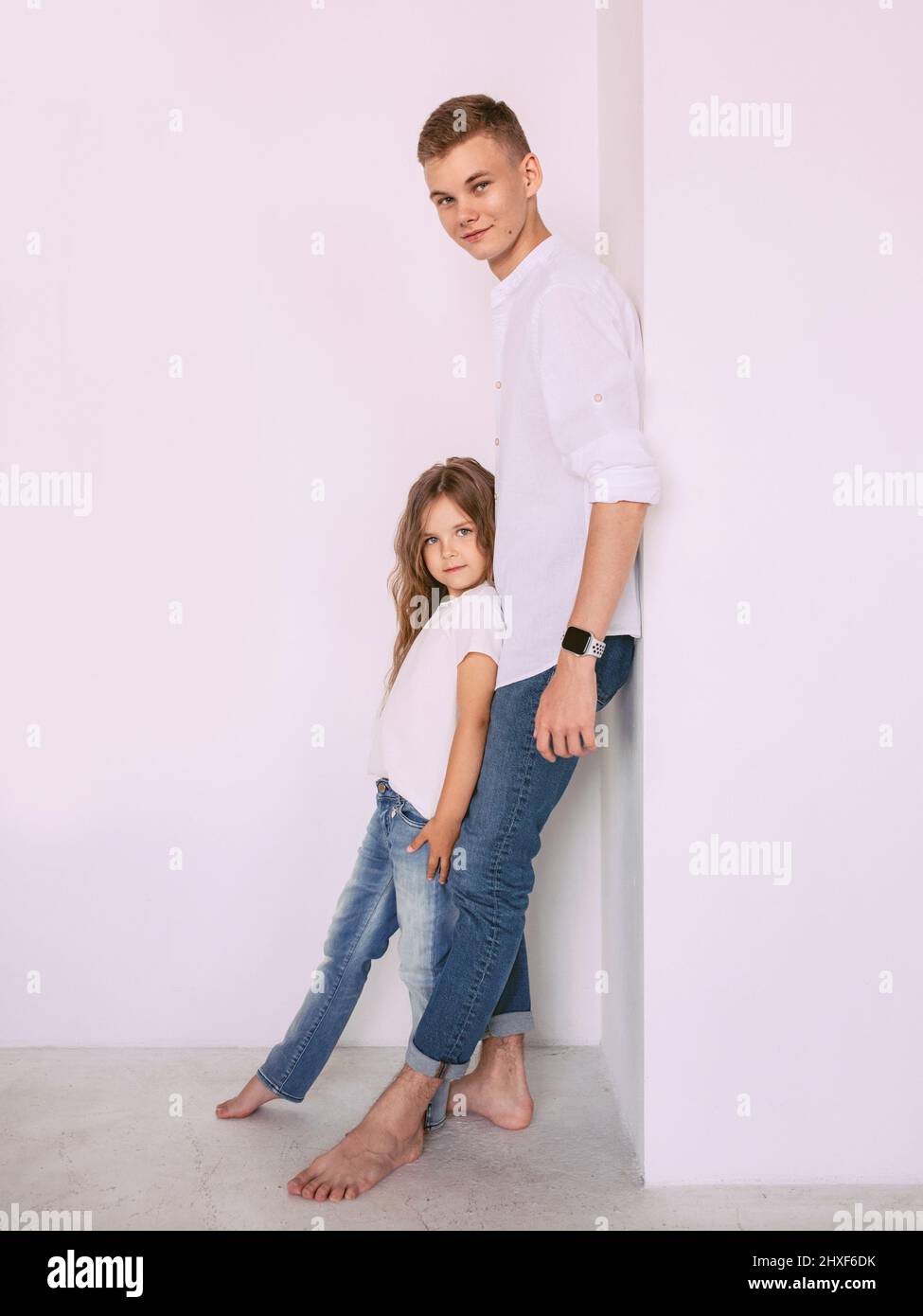 caucasian happy adorable siblings - teenager boy brother and little ...