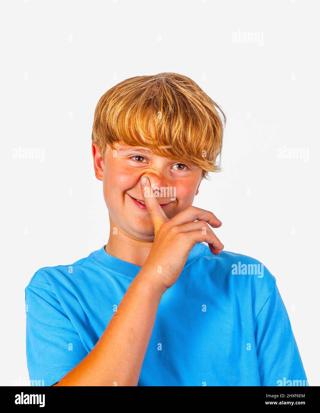 cute bold faced boy with white wall background Stock Photo - Alamy