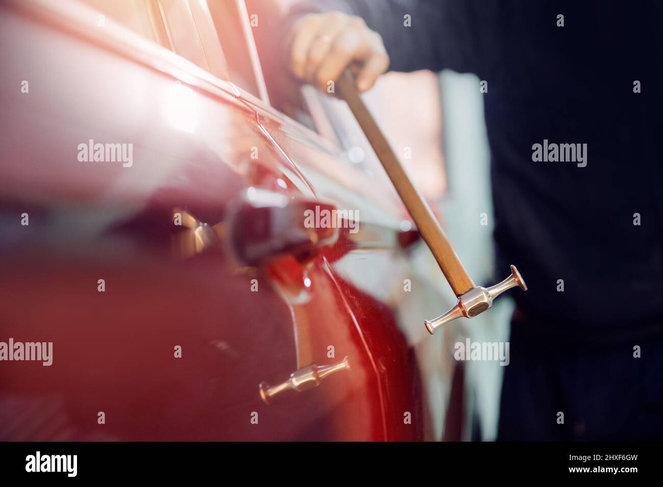 Car body repair, removal of dents paintless with knock tool Stock Photo ...