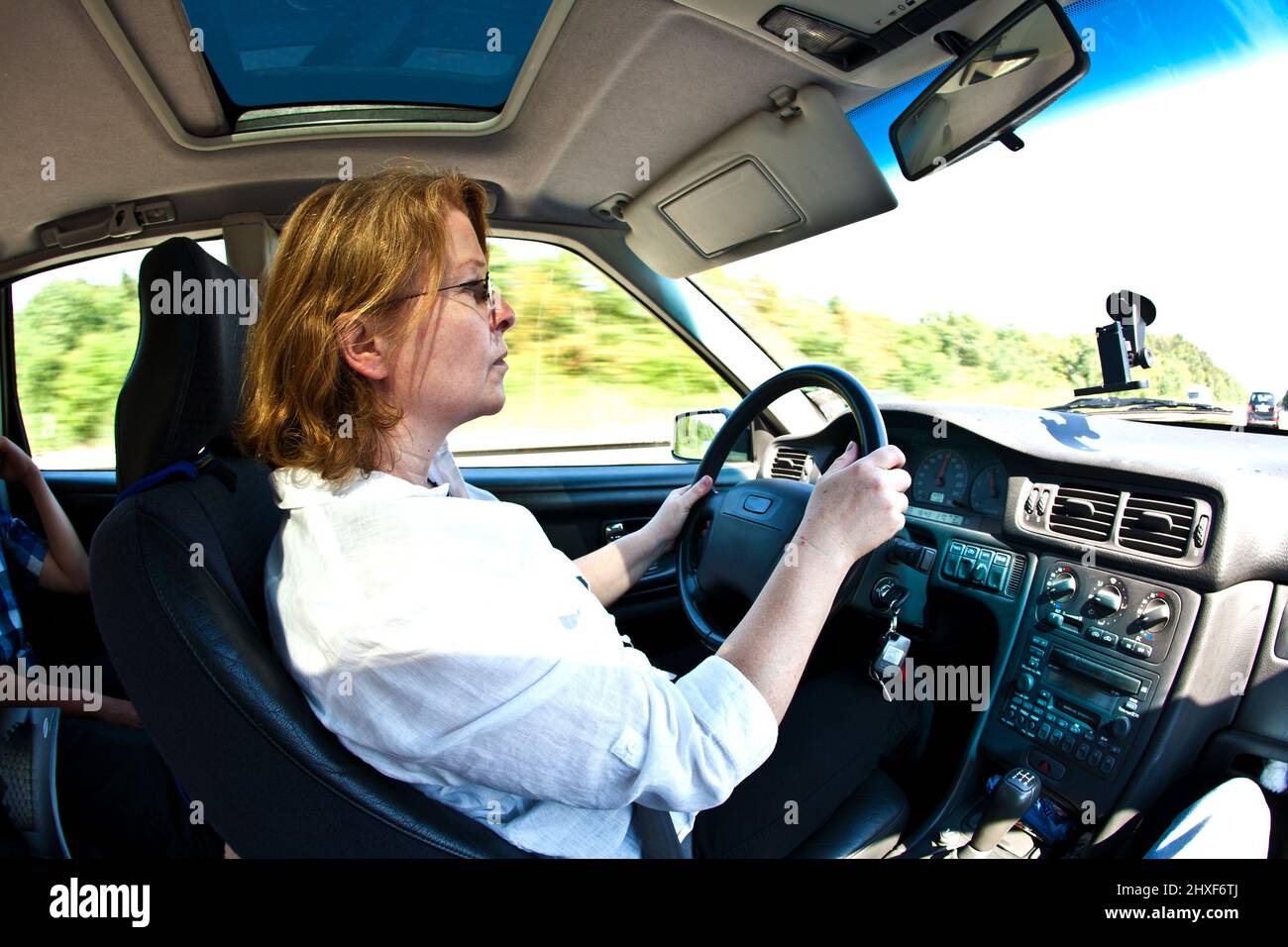 beautiful woman driving the car on the highway Stock Photo - Alamy