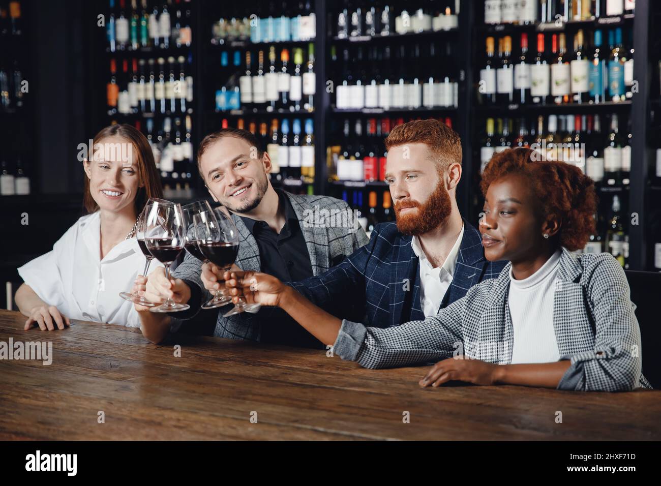 Fun Business meeting in restaurant with glass of red wine of young ...