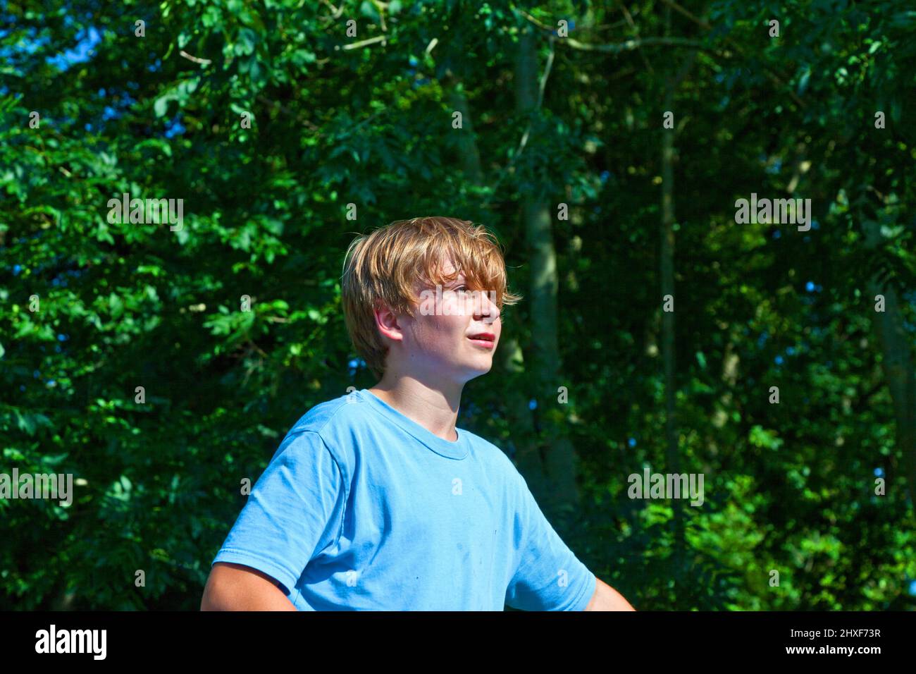 cute boy sweating after outdoor sports in nature Stock Photo - Alamy