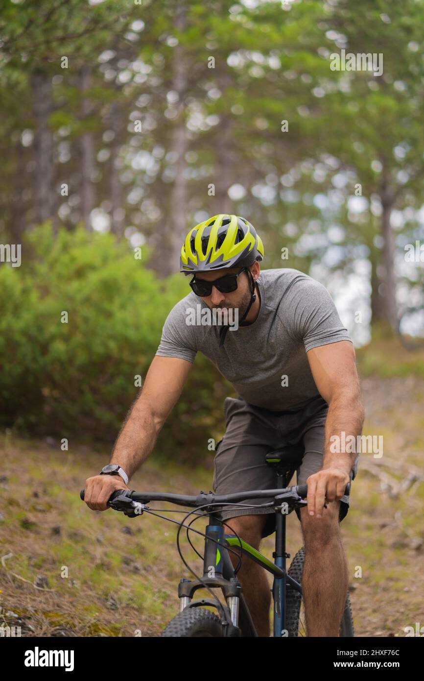 Portrait of handsome and fit guy riding his bike Stock Photo - Alamy