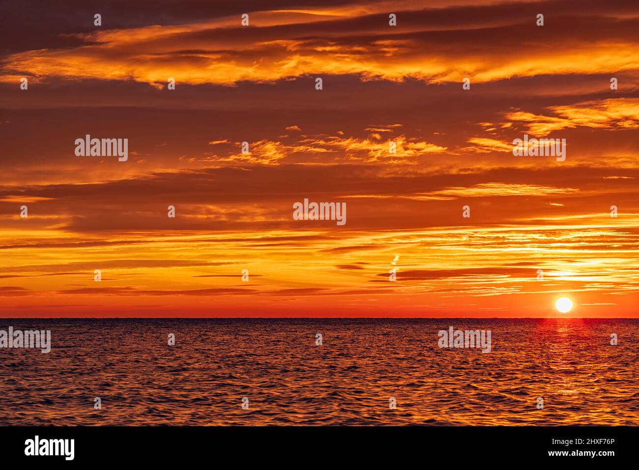 Amazing rising sun at sea horizon Stock Photo - Alamy