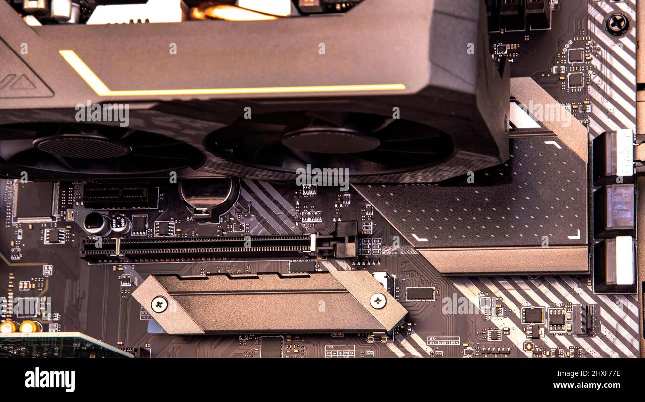 a part of a desktop computer. Video card on motherboard. Close up Stock ...