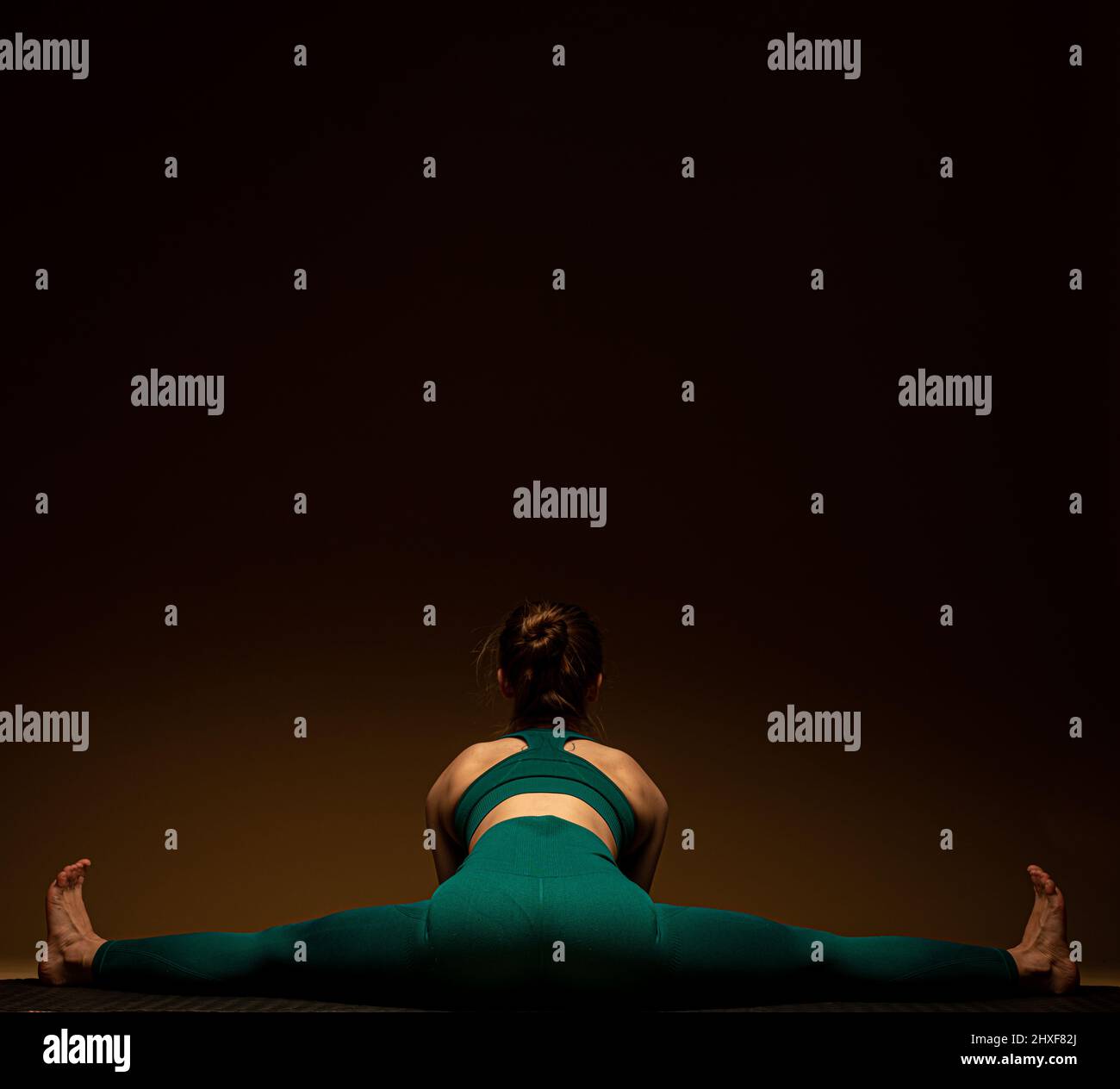 Attractive and beautiful young girl is doing some splits Stock Photo ...