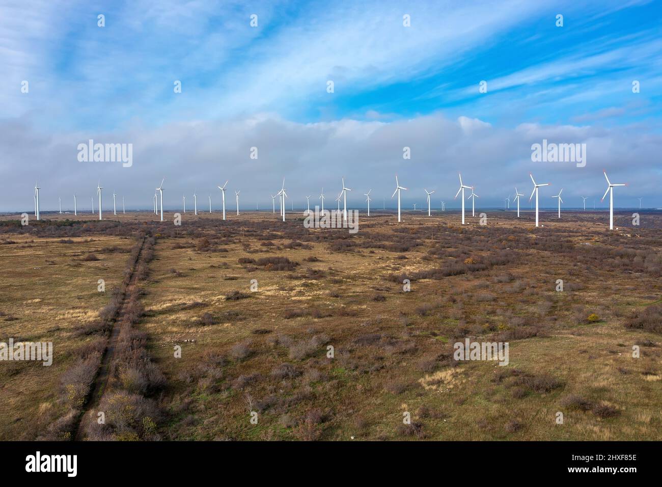 Aerial view to wind turbine farm. Horizontal view with cloudy sky Stock ...