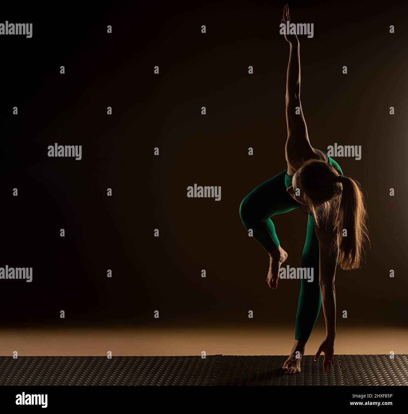 Attractive and beautiful young girl is trying to balance Stock Photo ...