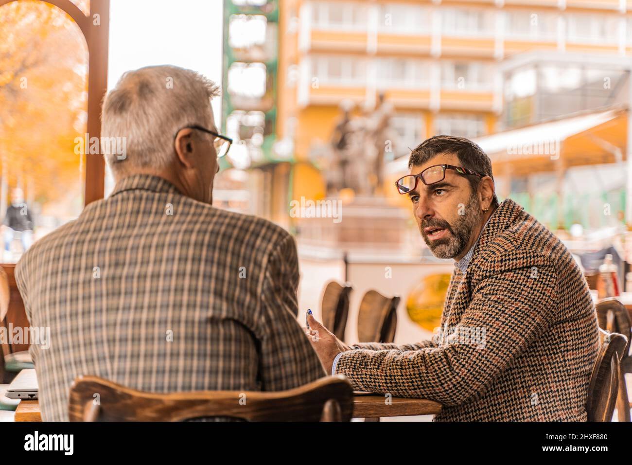 Two senior businessmen are having a serious conversation Stock Photo ...