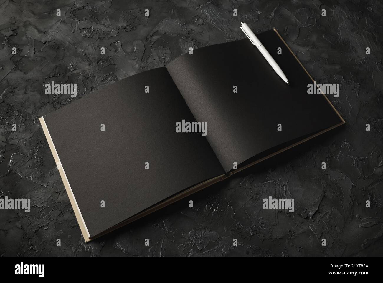 Blank Black Paper Sketchbook And Pen On Black Plaster Background Responsive Design Template blank-black-paper-sketchbook-and-pen-on-black-plaster-background-responsive-design-template