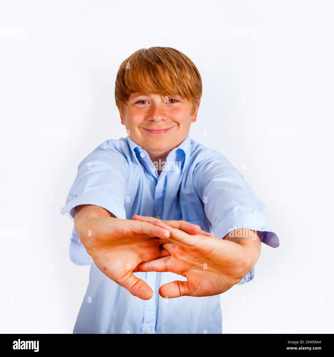 cute young happy boy shows his hands Stock Photo - Alamy