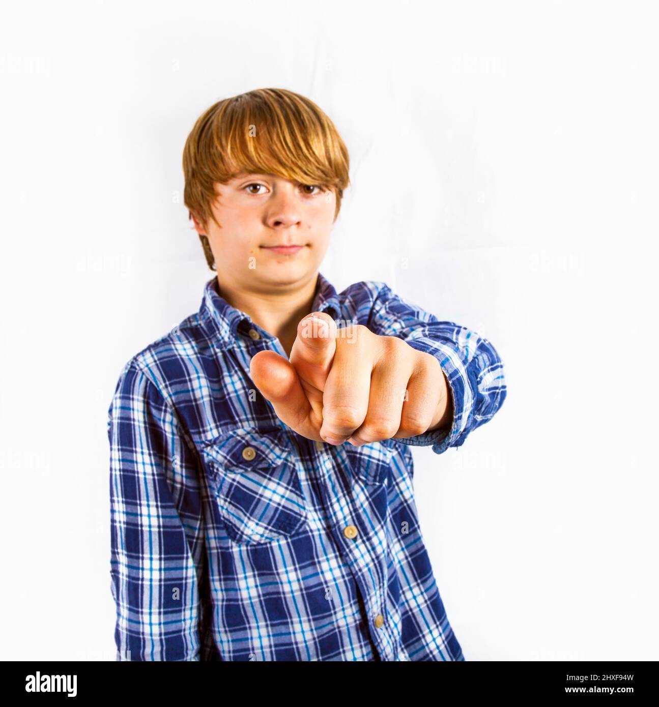 portrait of cute young happy boy pointing to someone Stock Photo - Alamy