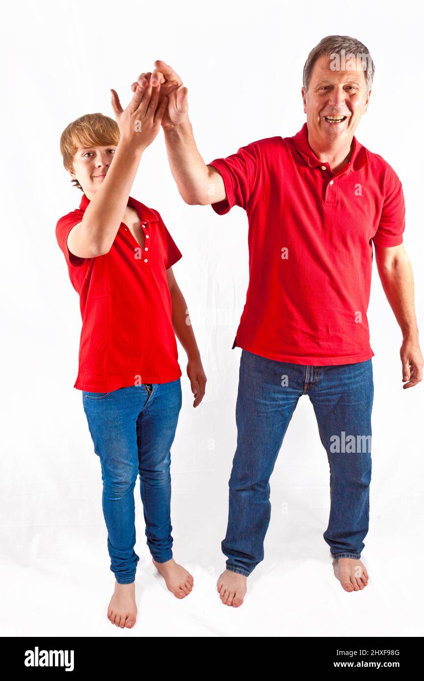 father and son giving high five Stock Photo - Alamy