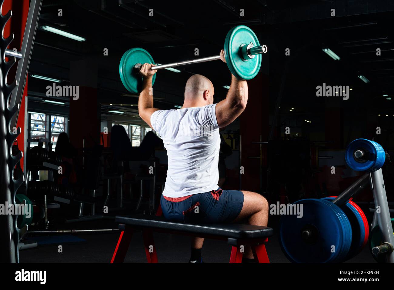 Muscular man lifts barbell hi-res stock photography and images - Alamy