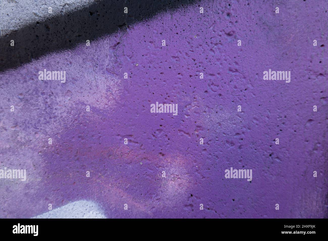 Fragment of stucco plaster wall with graffiti painting. Part of ...