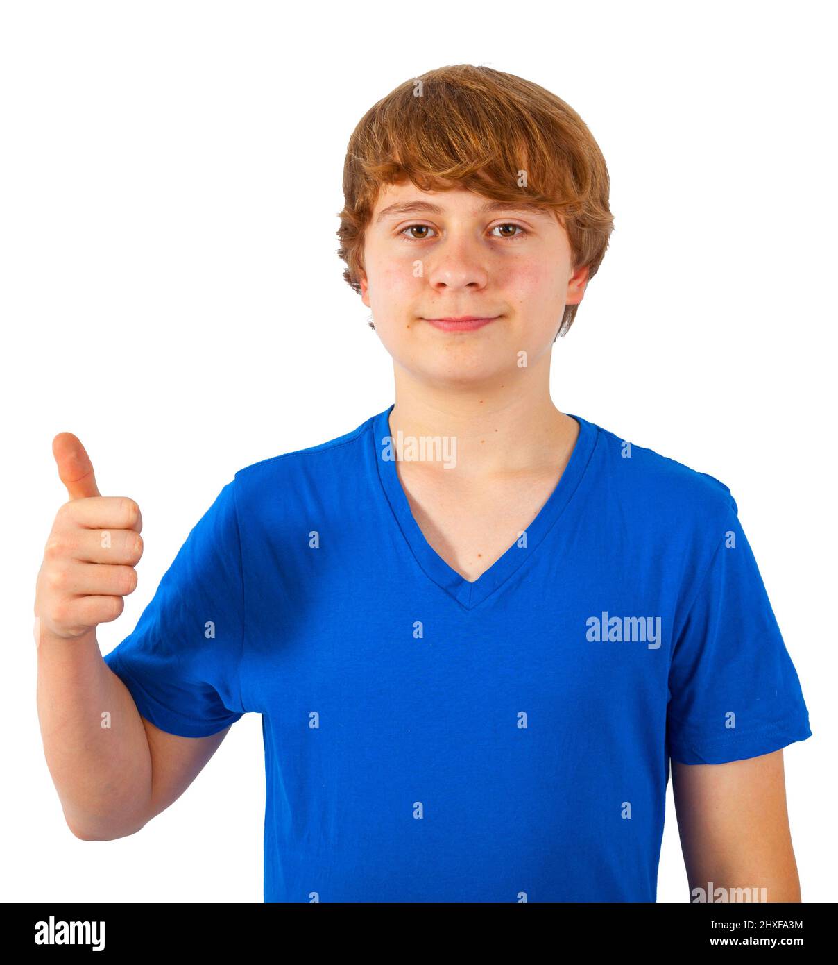 A smiling boy is showing his thumb up; isolated on the white background ...