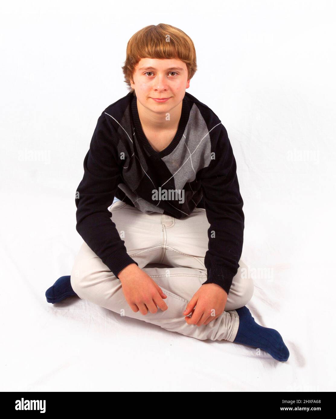 smart happy young boy posing in studio Stock Photo - Alamy