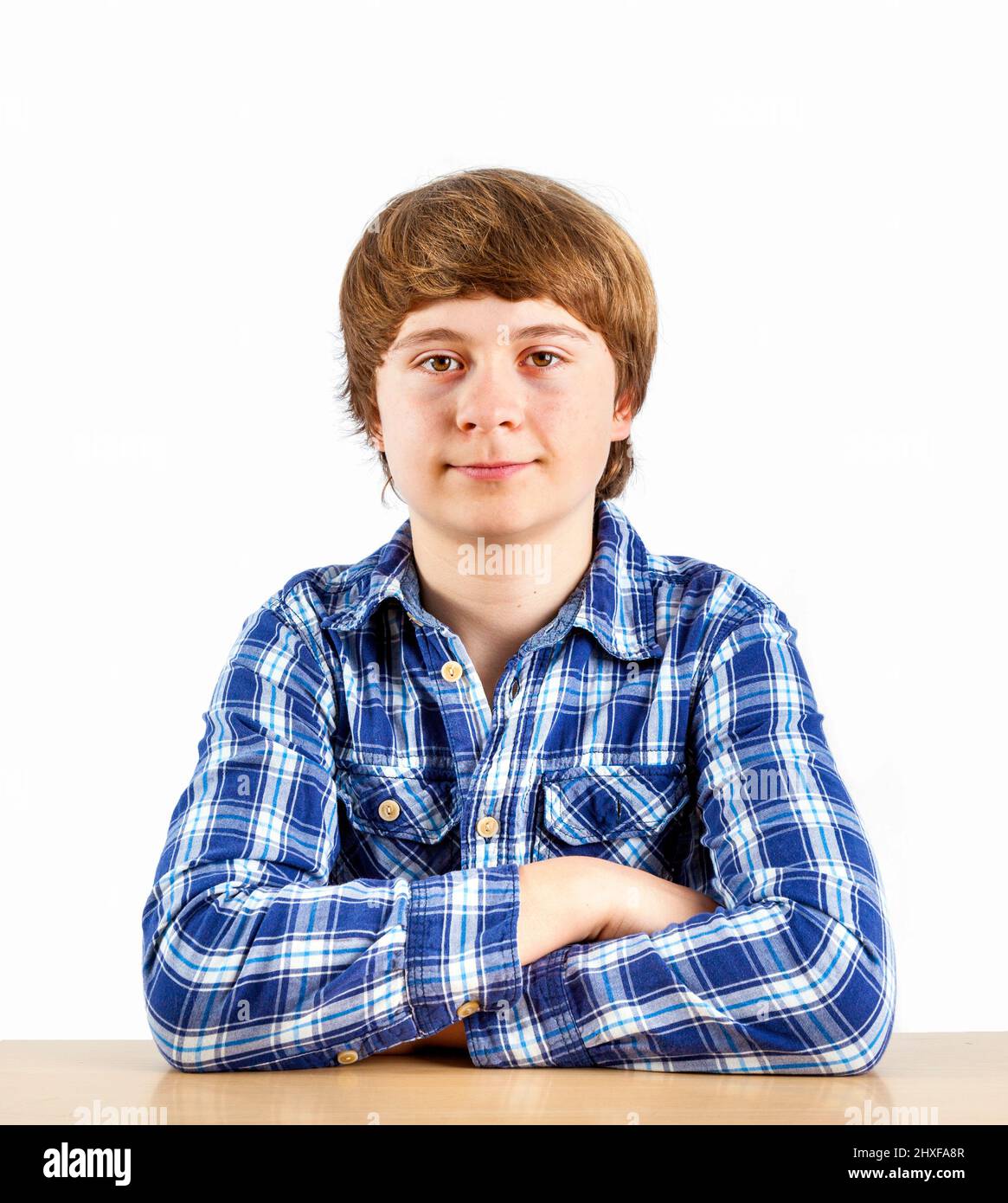 smart boy sitting at his school desk Stock Photo - Alamy