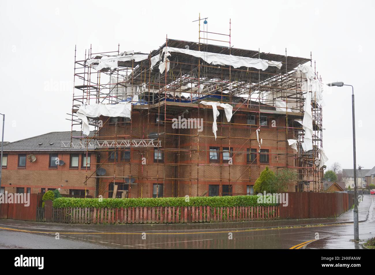 Derelict council house in poor housing estate slum with many social ...