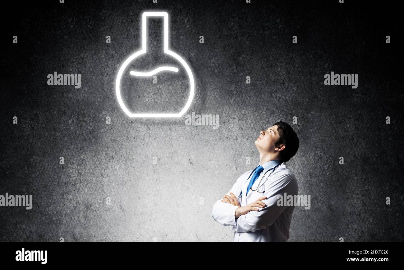Doctor and vial symbol Stock Photo - Alamy