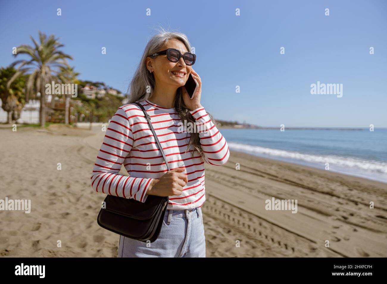 Cute Asian lady walking in day time outdoors Stock Photo - Alamy
