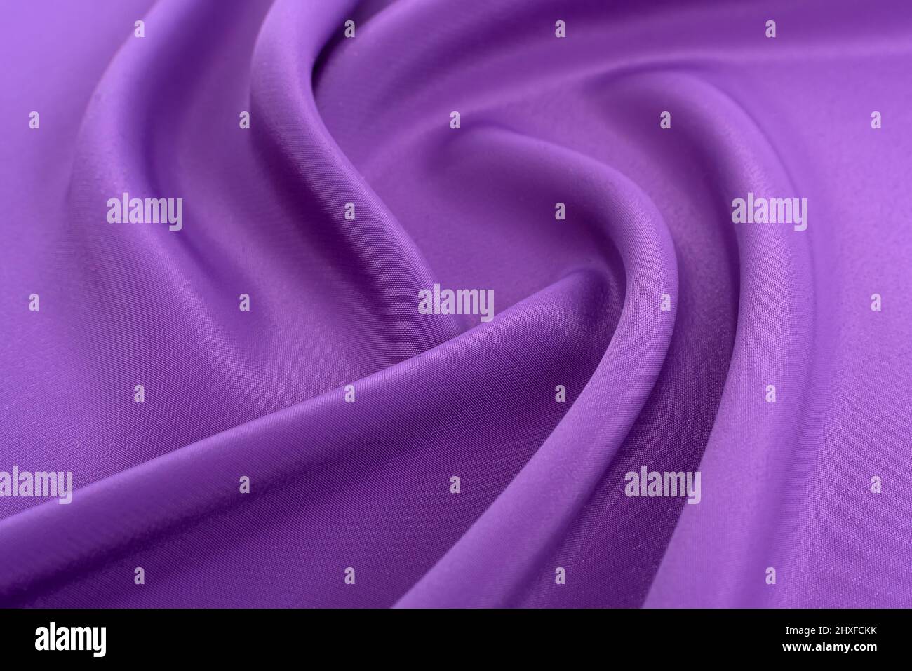 A piece of purple cloth. Fabric texture for background and design works ...