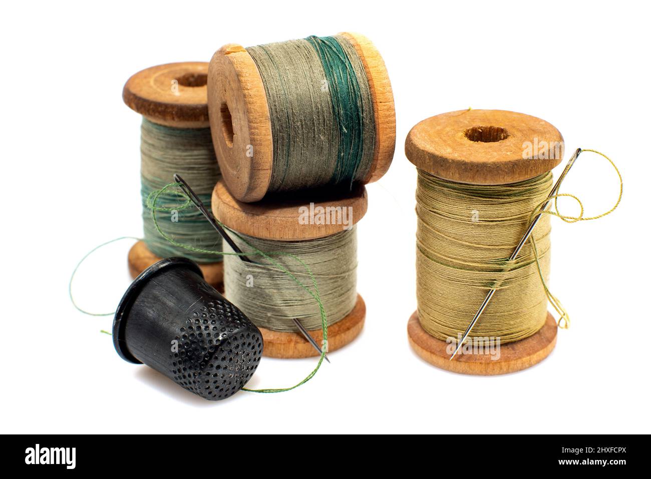 Vintage retro spool of thread on a white background. Needle with thread ...