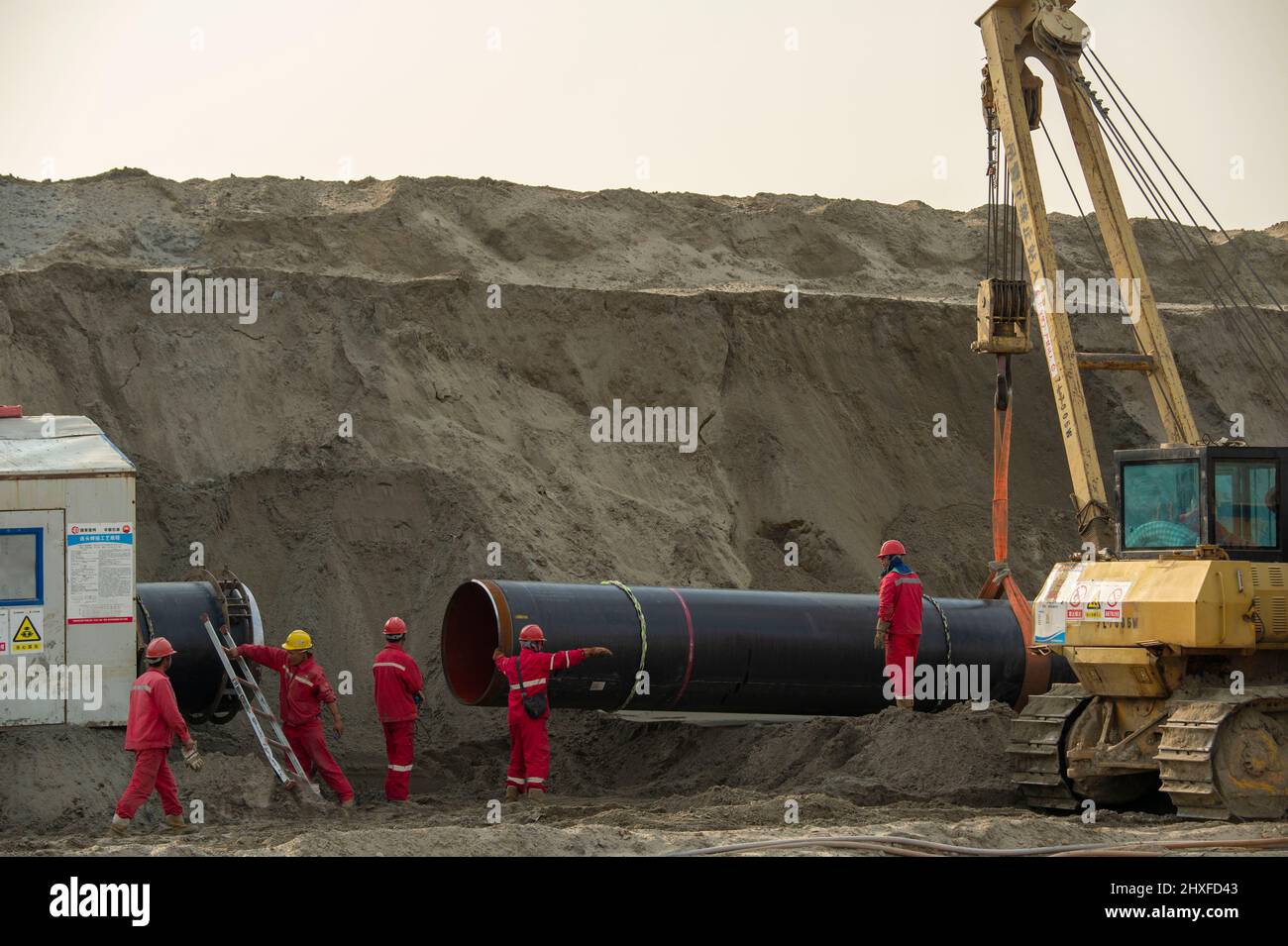 HAIAN, CHINA - MARCH 12, 2022 - Workers work at the construction site ...
