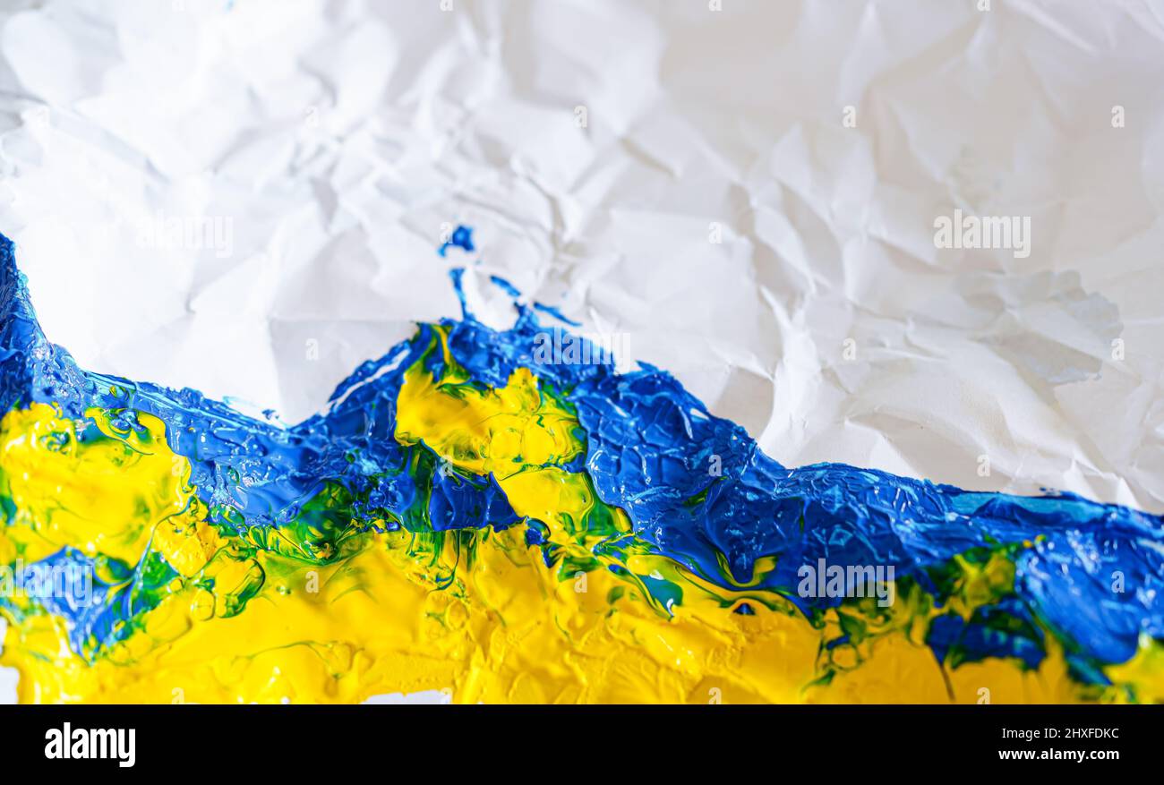 Ukraine colors at the folded black paper Stock Photo - Alamy