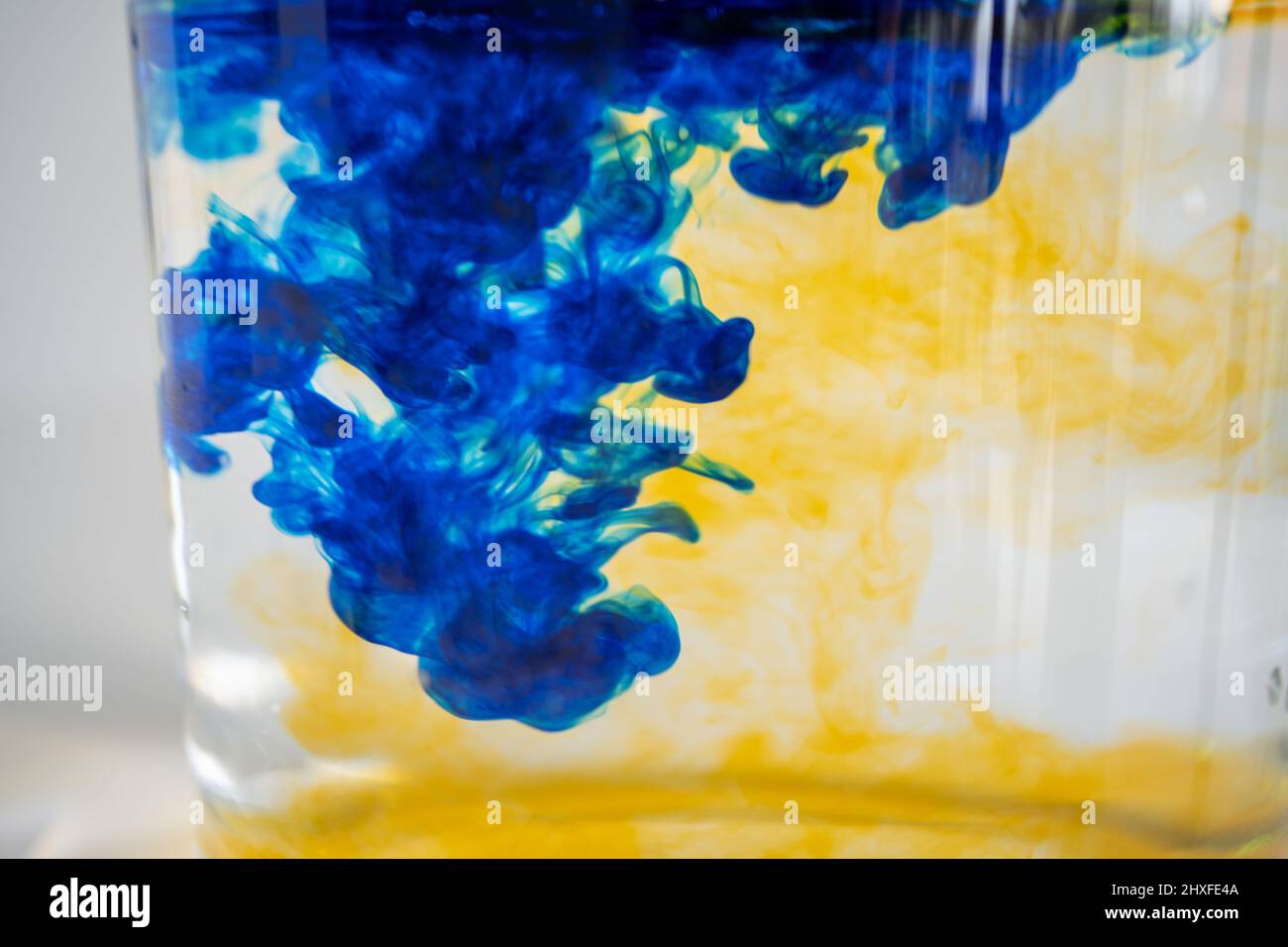 color drops in water glass Stock Photo - Alamy