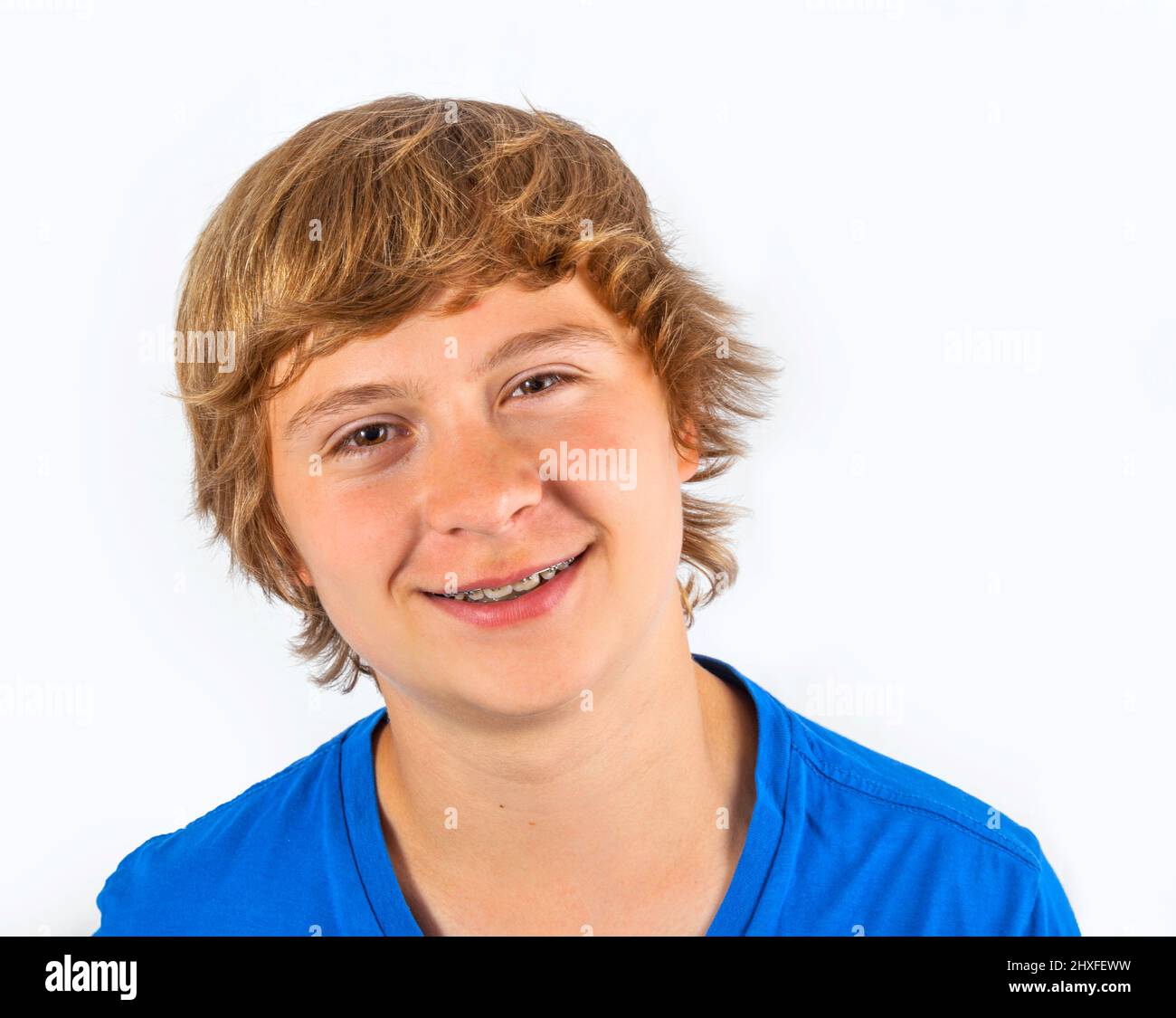 cute handsome boy with blue shirt enjoys posing Stock Photo - Alamy