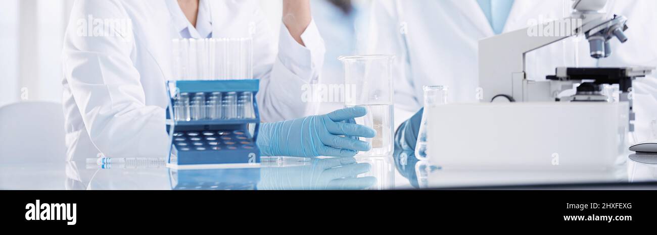 happy employees of the scientific laboratory sitting at the labo Stock ...