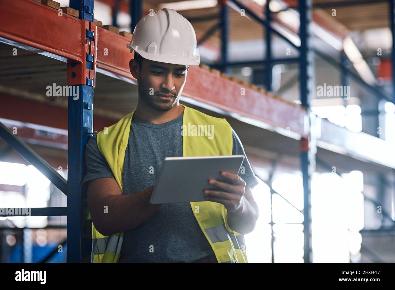 Get all the info where and when you need it. Shot of a builder using a ...