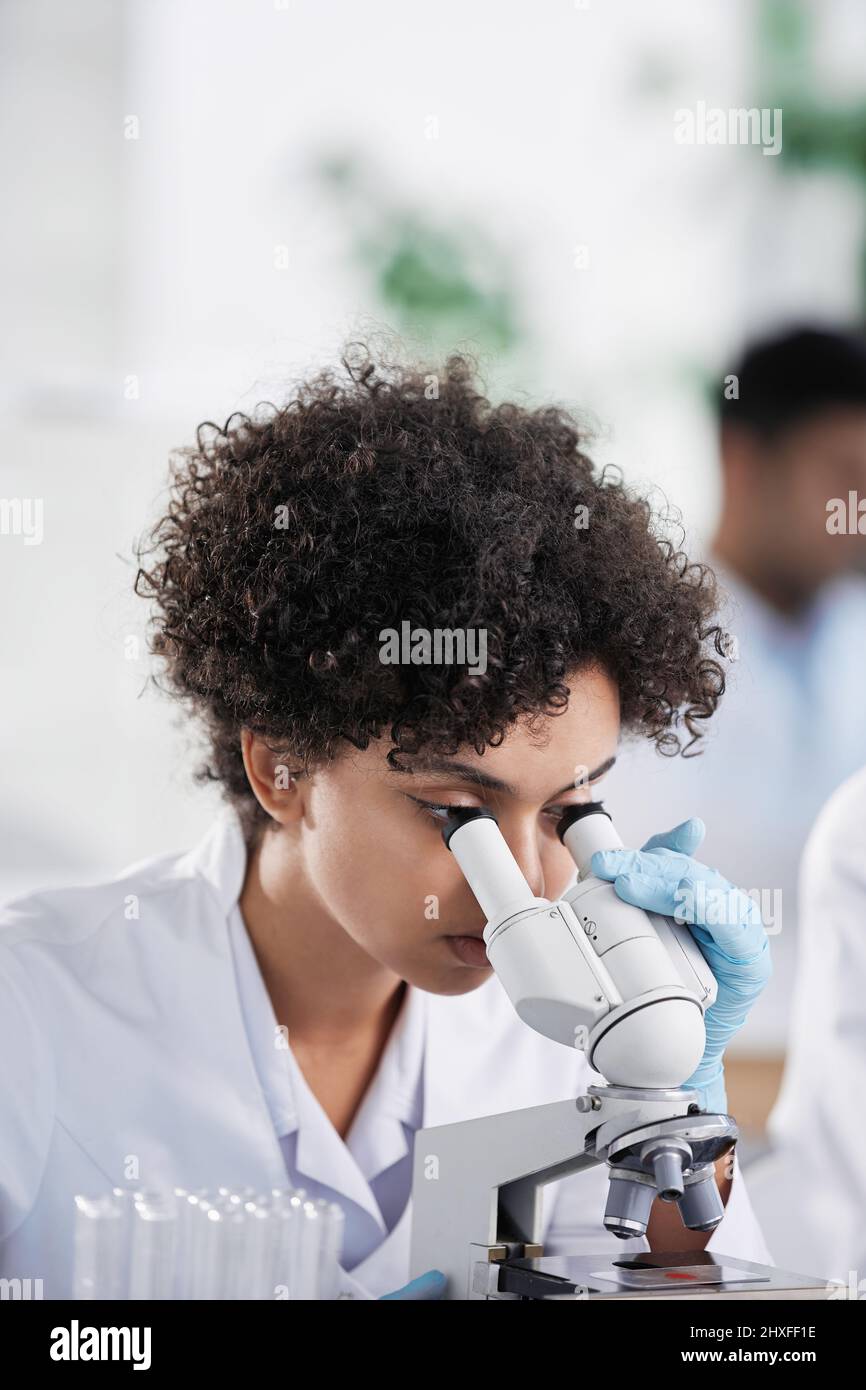 Female chemist microscope table hi-res stock photography and images - Alamy