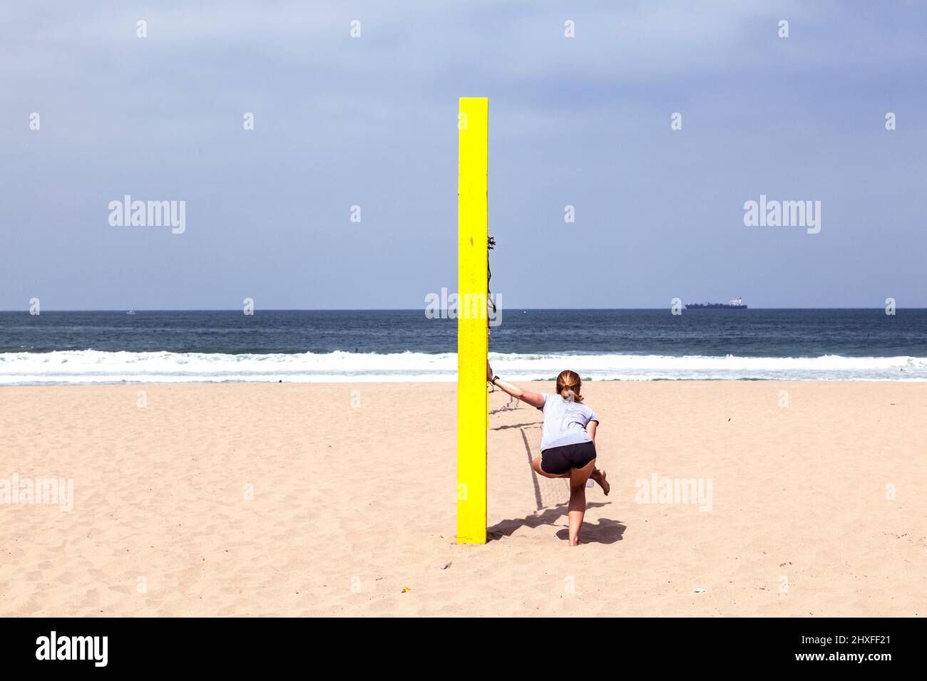 volleyball post at the beach in blue Stock Photo - Alamy