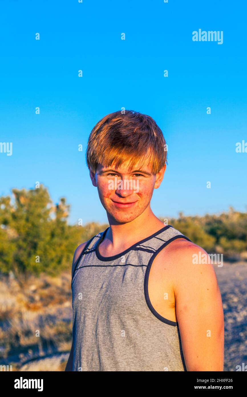 sunset with smiling attractive boy in Joshua tree landscape Stock Photo ...