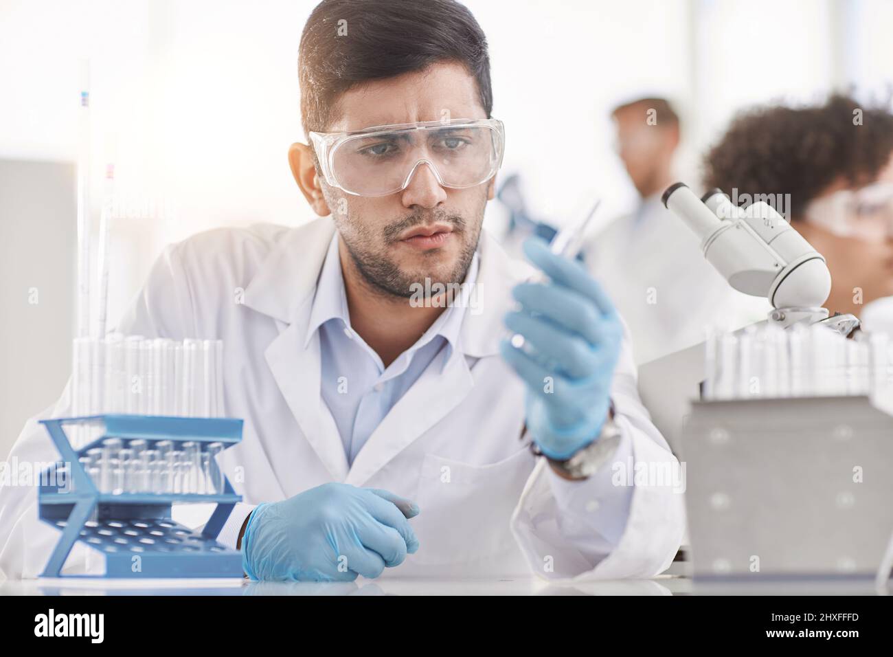 Looking at test tube and goggles hi-res stock photography and images ...
