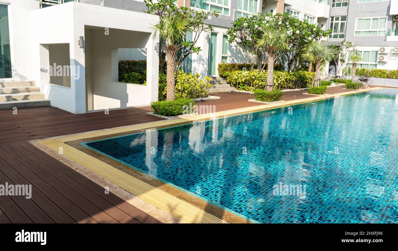 clean water swimming pool in the condominium roof top view, Garden in ...