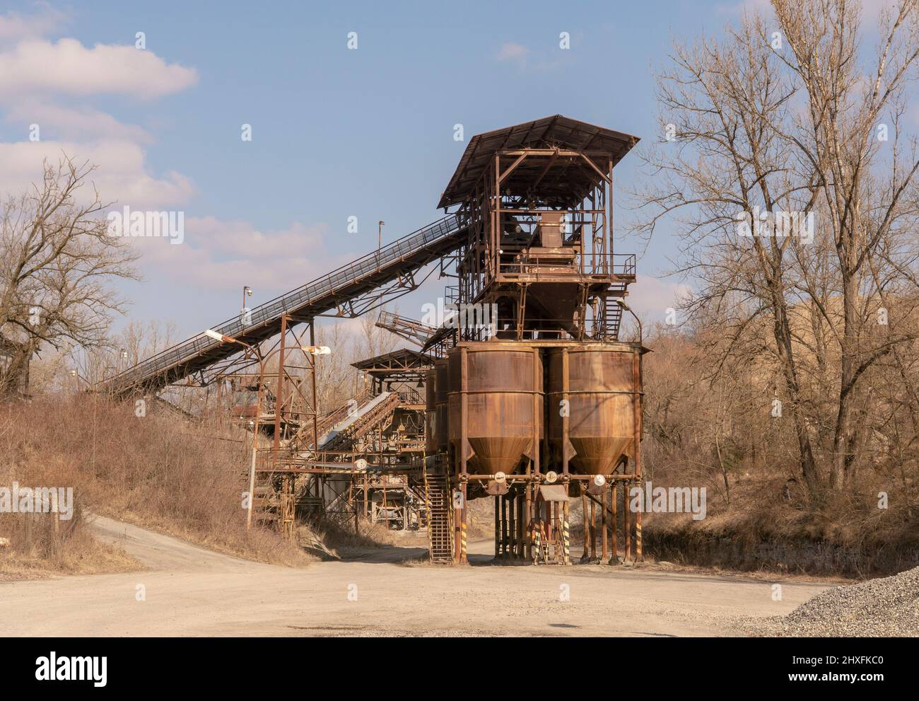 An old gravel quarry. Mining and quarrying equipment. Granite gravel ...