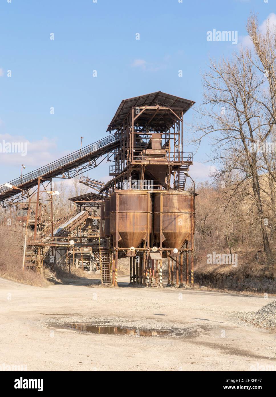 An old gravel quarry. Mining and quarrying equipment. Granite gravel ...