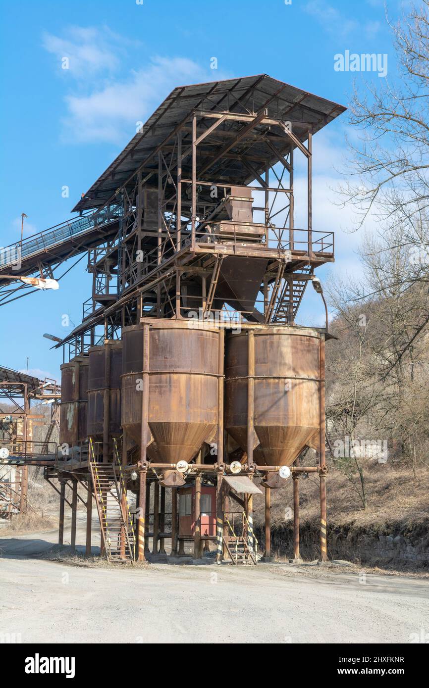 An old gravel quarry. Mining and quarrying equipment. Granite gravel ...
