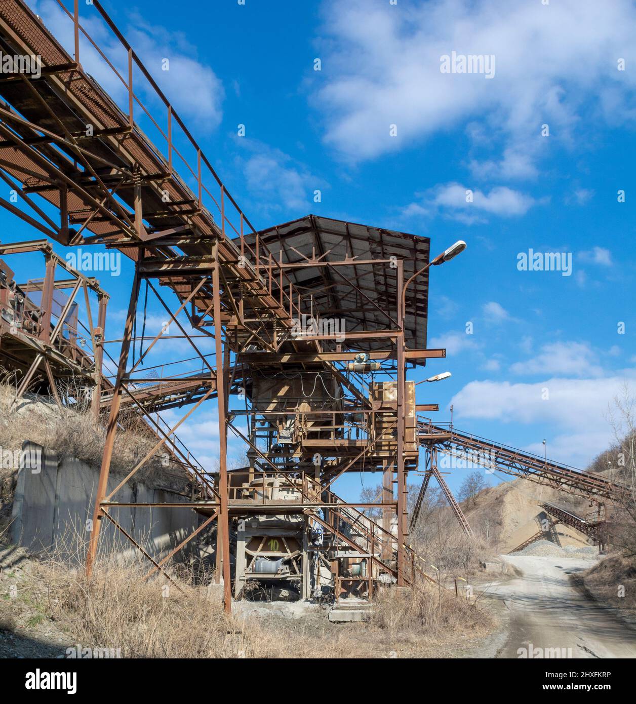 An old gravel quarry. Mining and quarrying equipment. Granite gravel ...